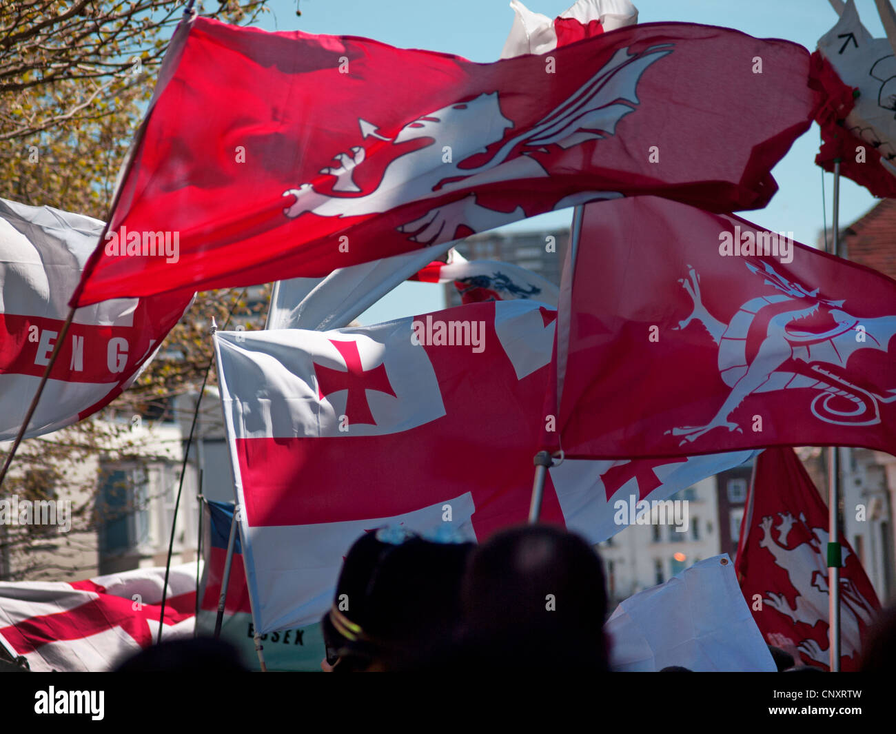 Flags fly at an EDL rally in Brighton Stock Photo - Alamy