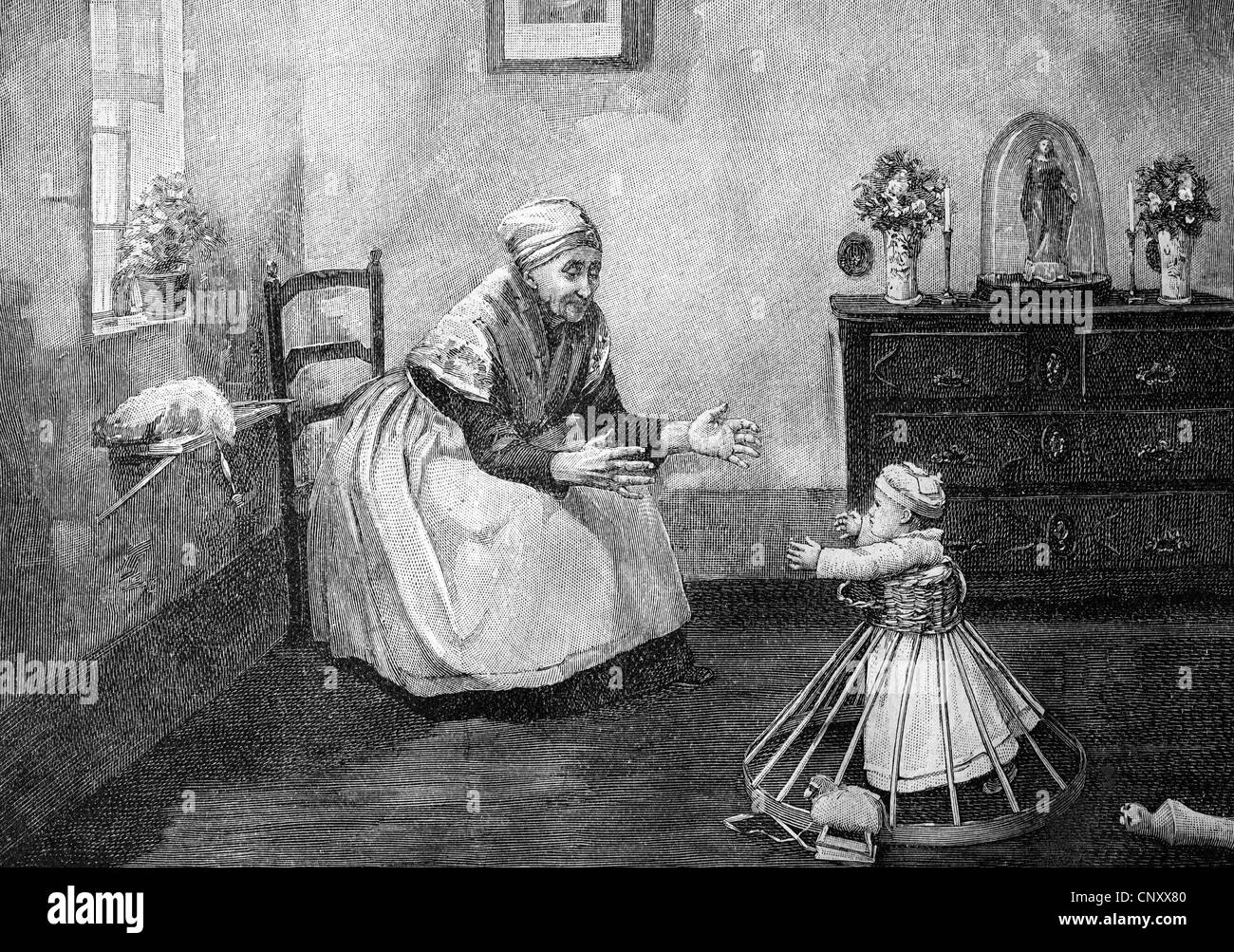 Toddler walking, first steps with a walking aid, historic wood ...