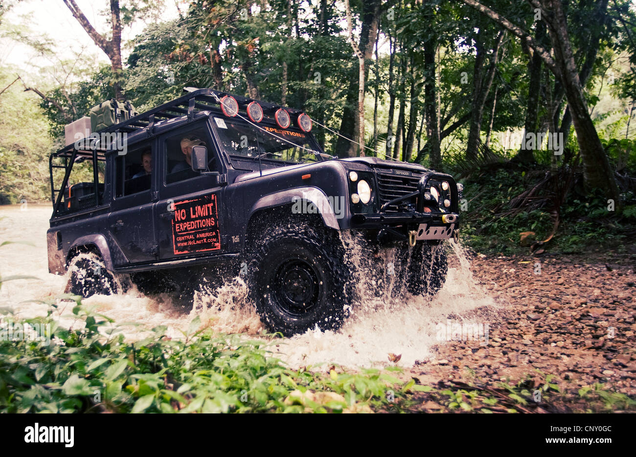 A Land Rover fords a river in Belize Stock Photo - Alamy