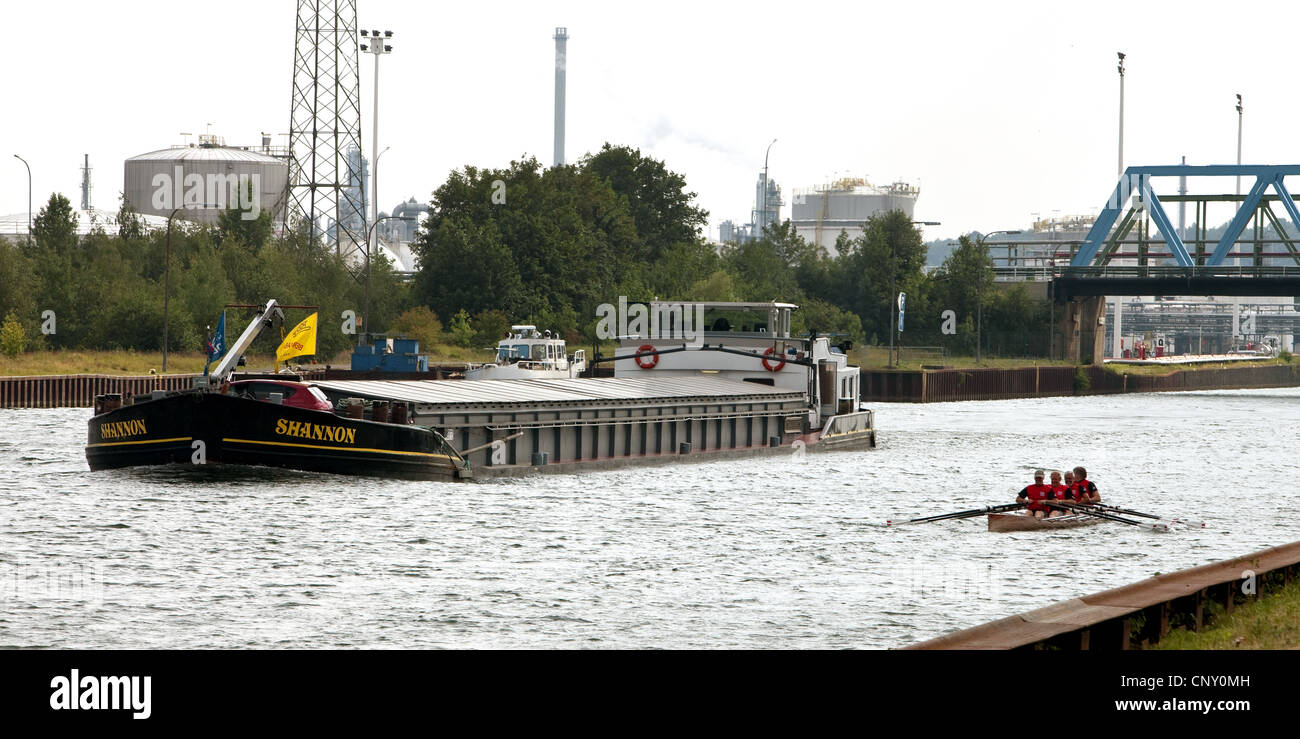 cargo ship and oarsmen on the Wesel-Datteln Canal at the coal harbour ...