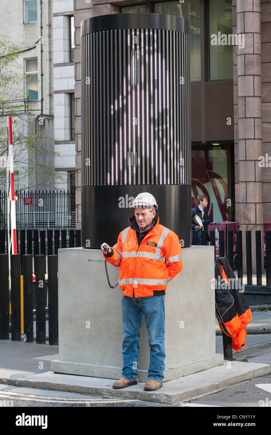 City of London elderly British worker workman in day glow jacket helmet ...