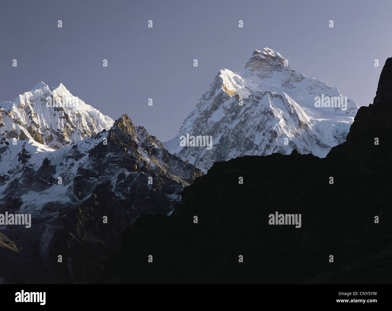 dramatic peak of Jannu and nearby mountains in the Kangchenjunga Himal ...
