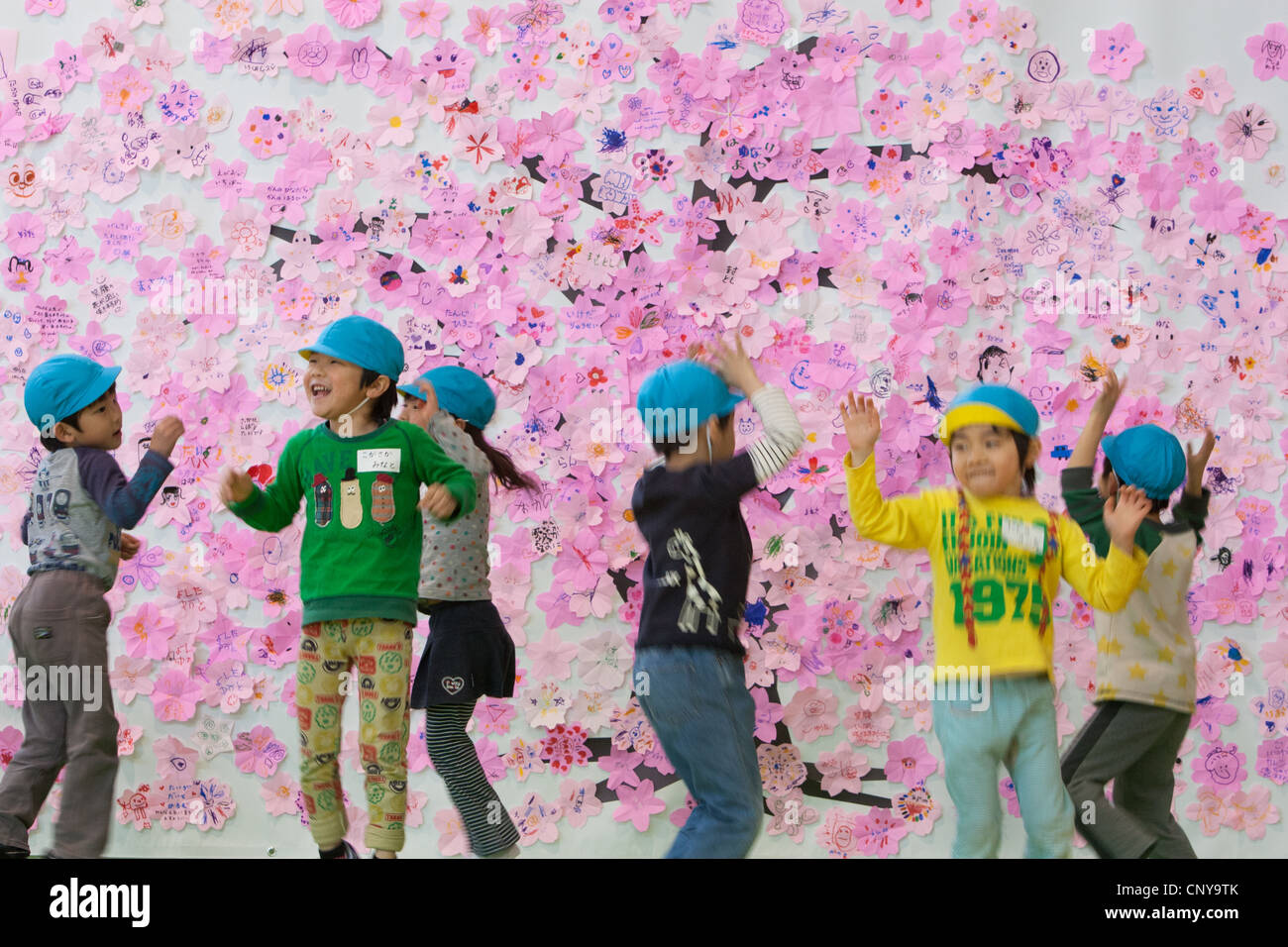 Young nursery school children play in the Red Cross 'Smile Park', in ...