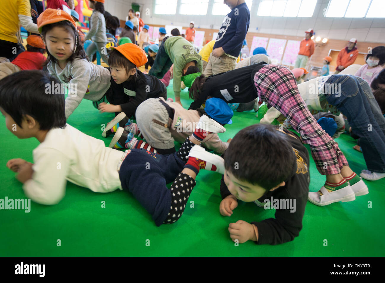 Young nursery school children play in the Red Cross 'Smile Park', in ...