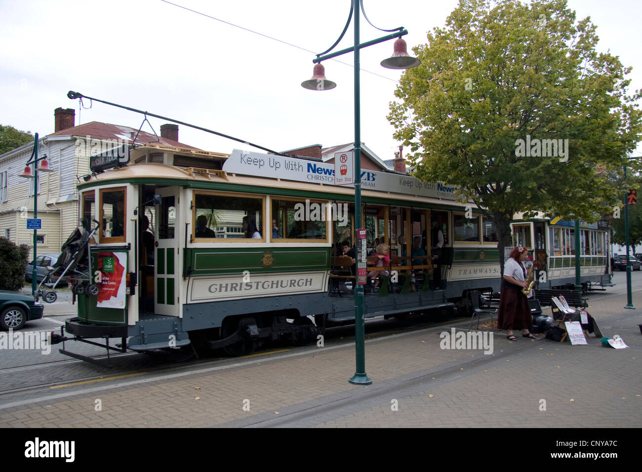 City's tram and the musician Elle Walker, Christchurch Stock Photo - Alamy