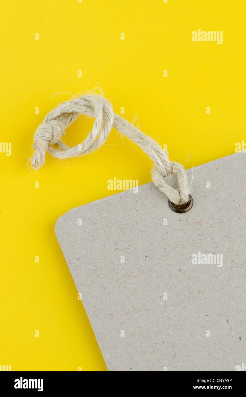 Closeup of blank product info label on yellow background Stock Photo ...