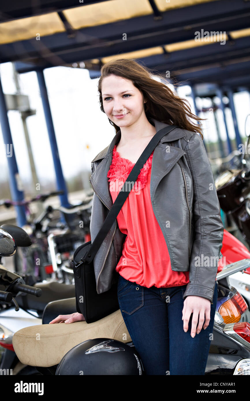 young girl driving a scooter Stock Photo - Alamy