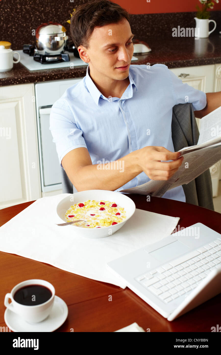 Fat man reading newspaper hi-res stock photography and images - Alamy