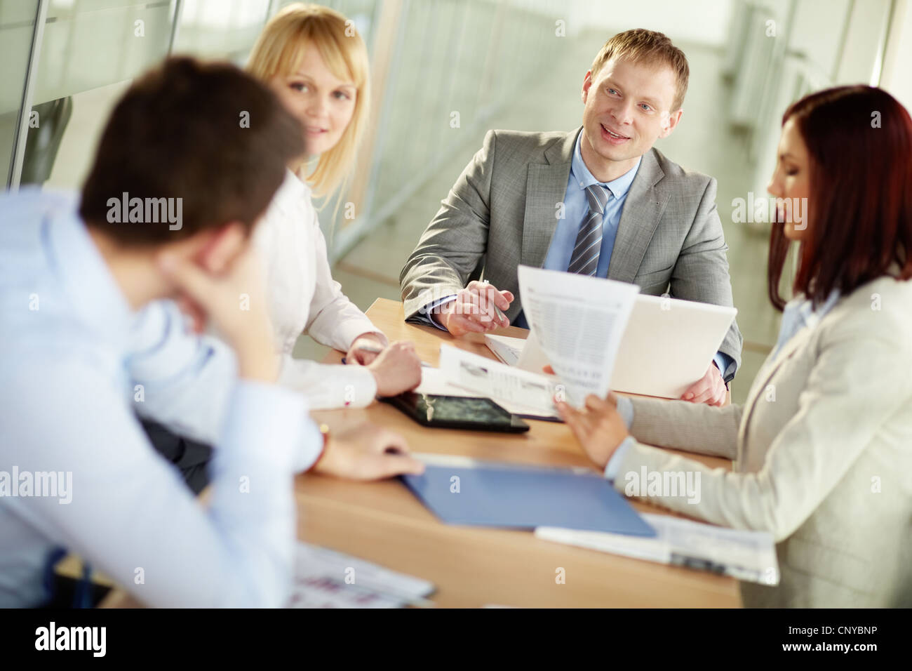 Leader of a business group encouraging his colleagues to bring forward ...