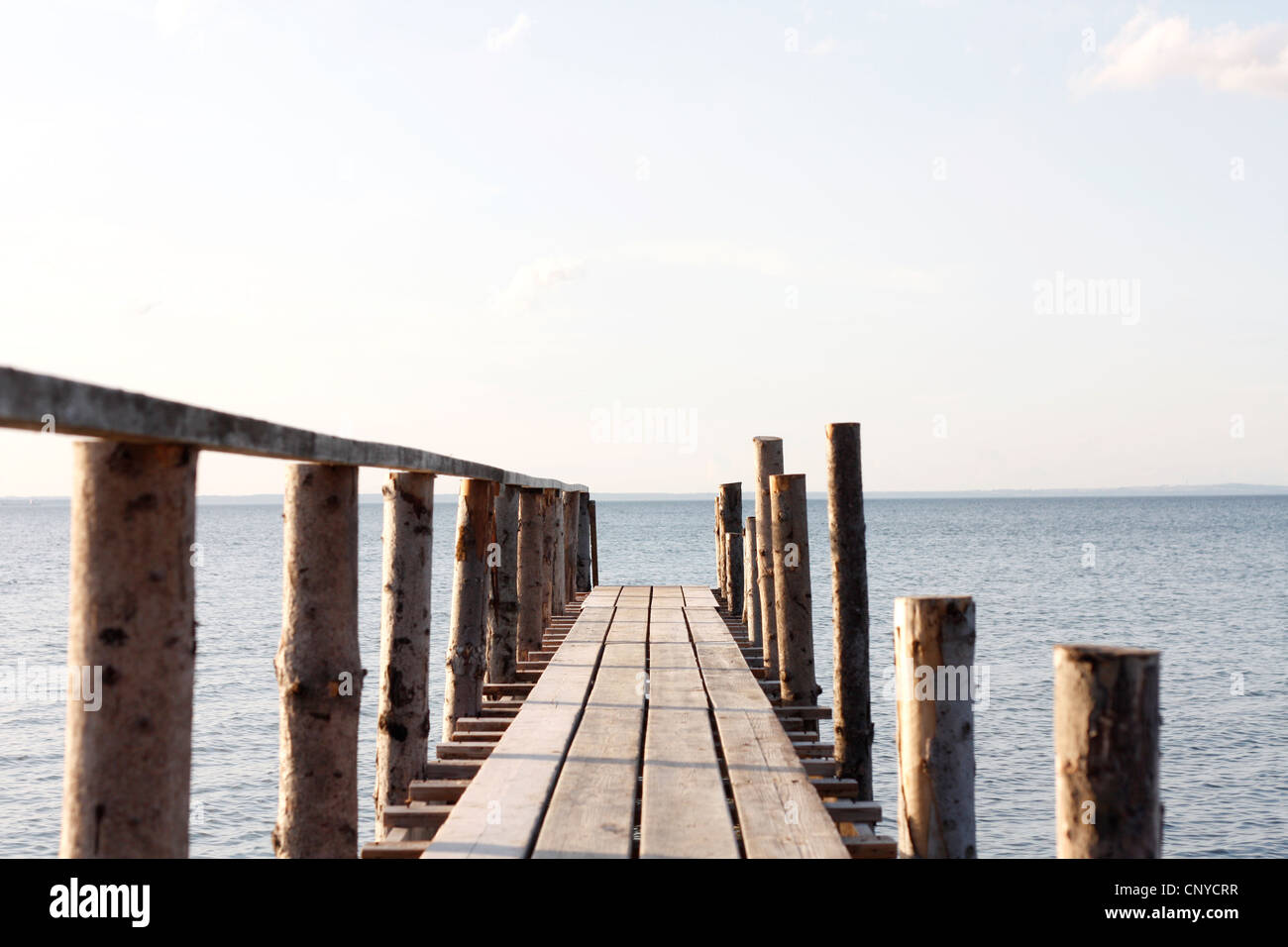 Wooden pier in sea sunset hi-res stock photography and images - Alamy
