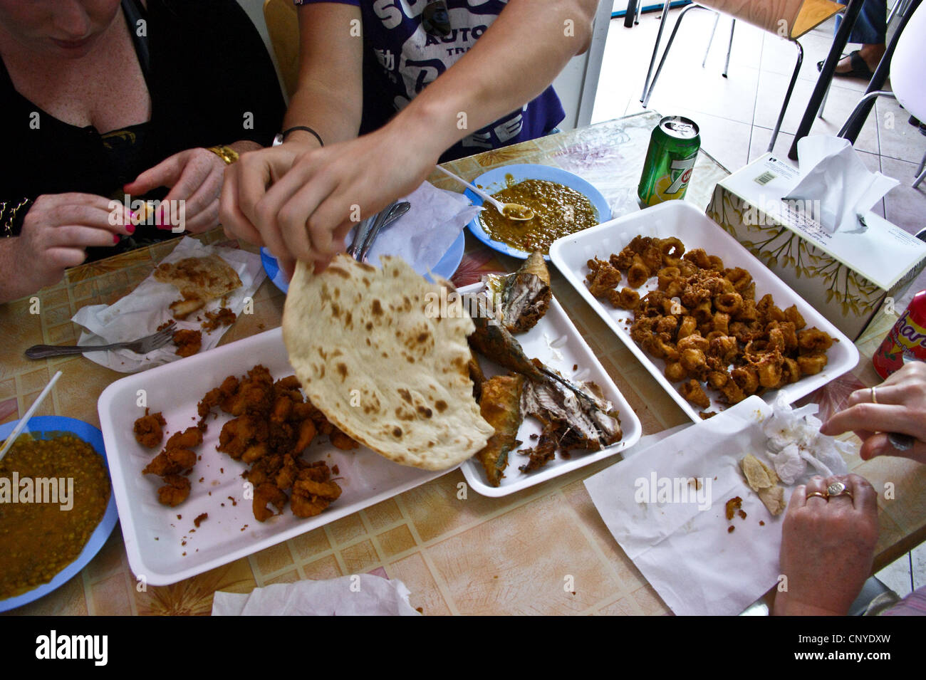 A fresh fish meal of Indian mackerel and shrimps at Dubai fish souq ...