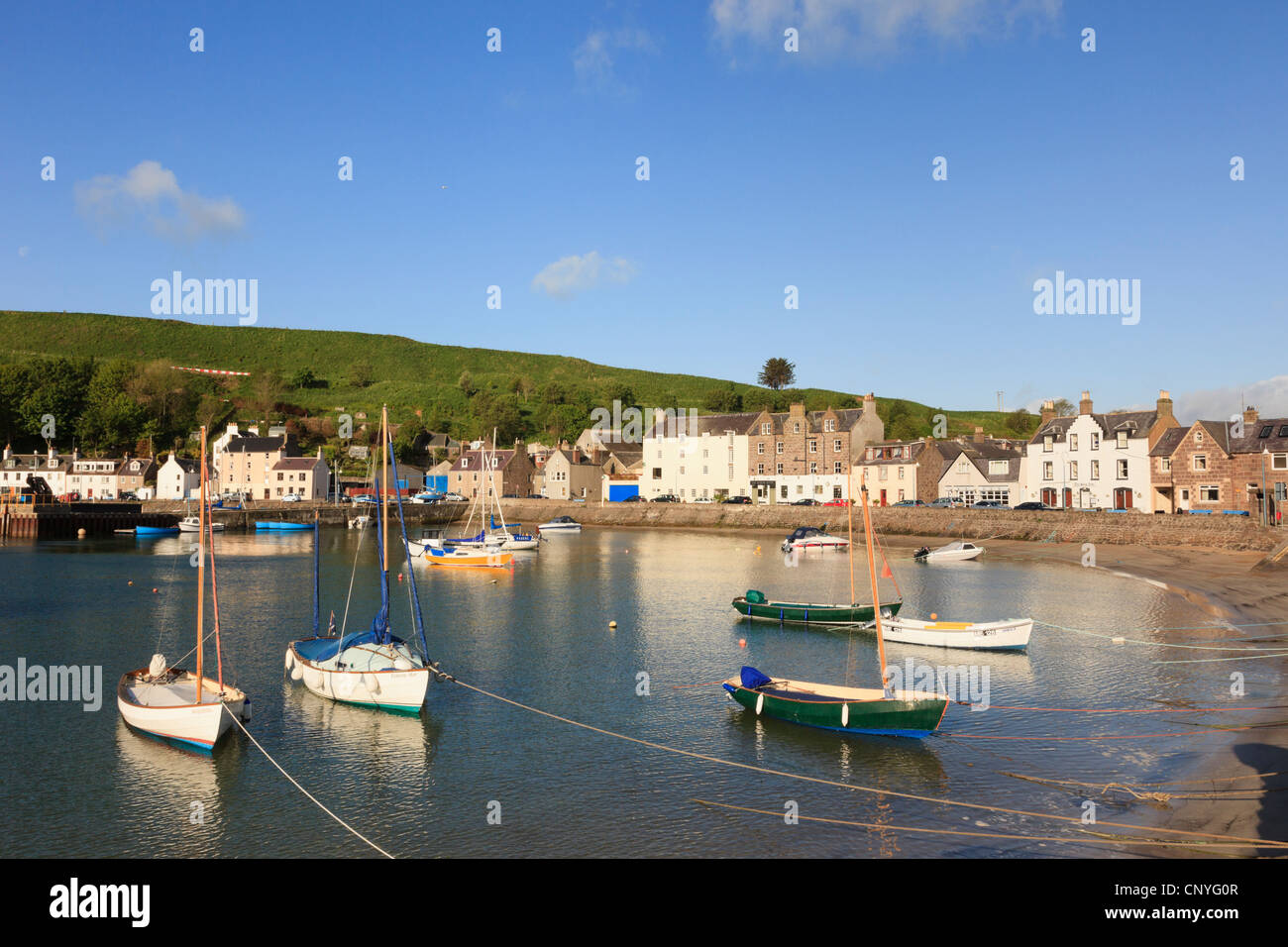 View across fishing port with small boats in harbour at Stonehaven ...