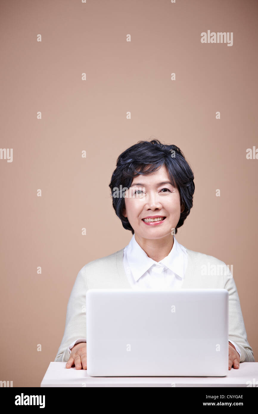 A smiling old woman with laptop Stock Photo - Alamy