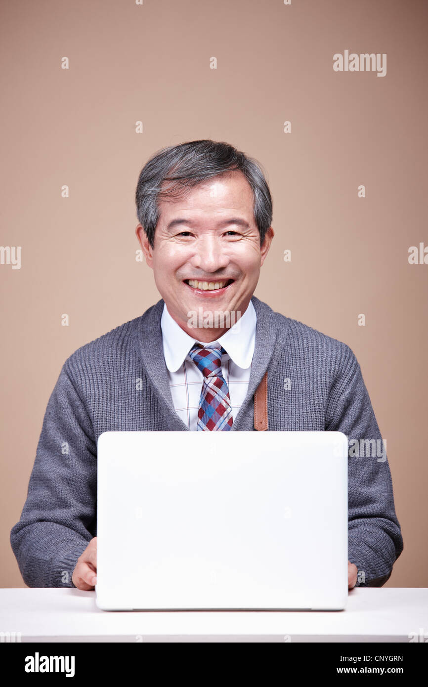 An old man with laptop Stock Photo - Alamy