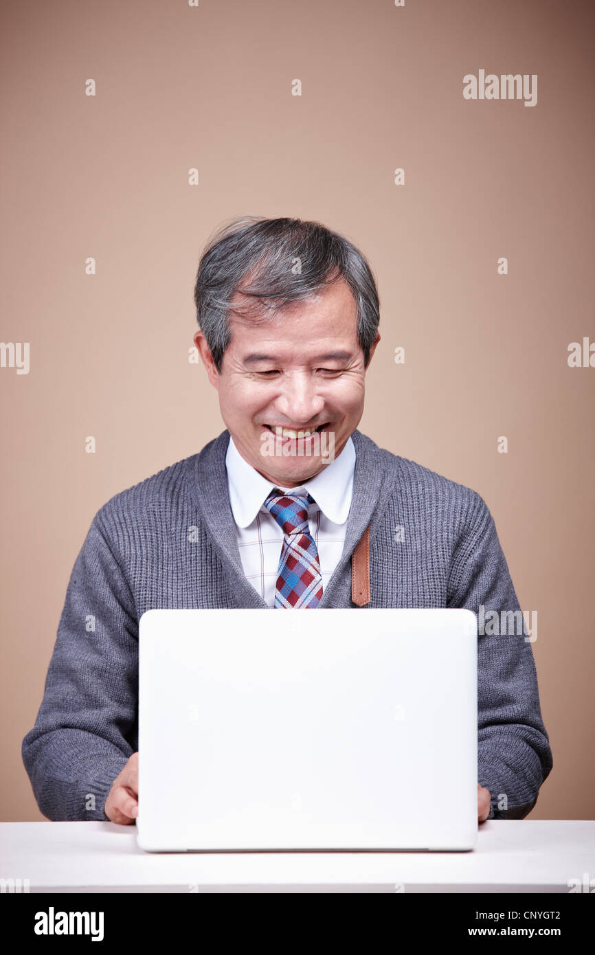 An old man with laptop Stock Photo - Alamy