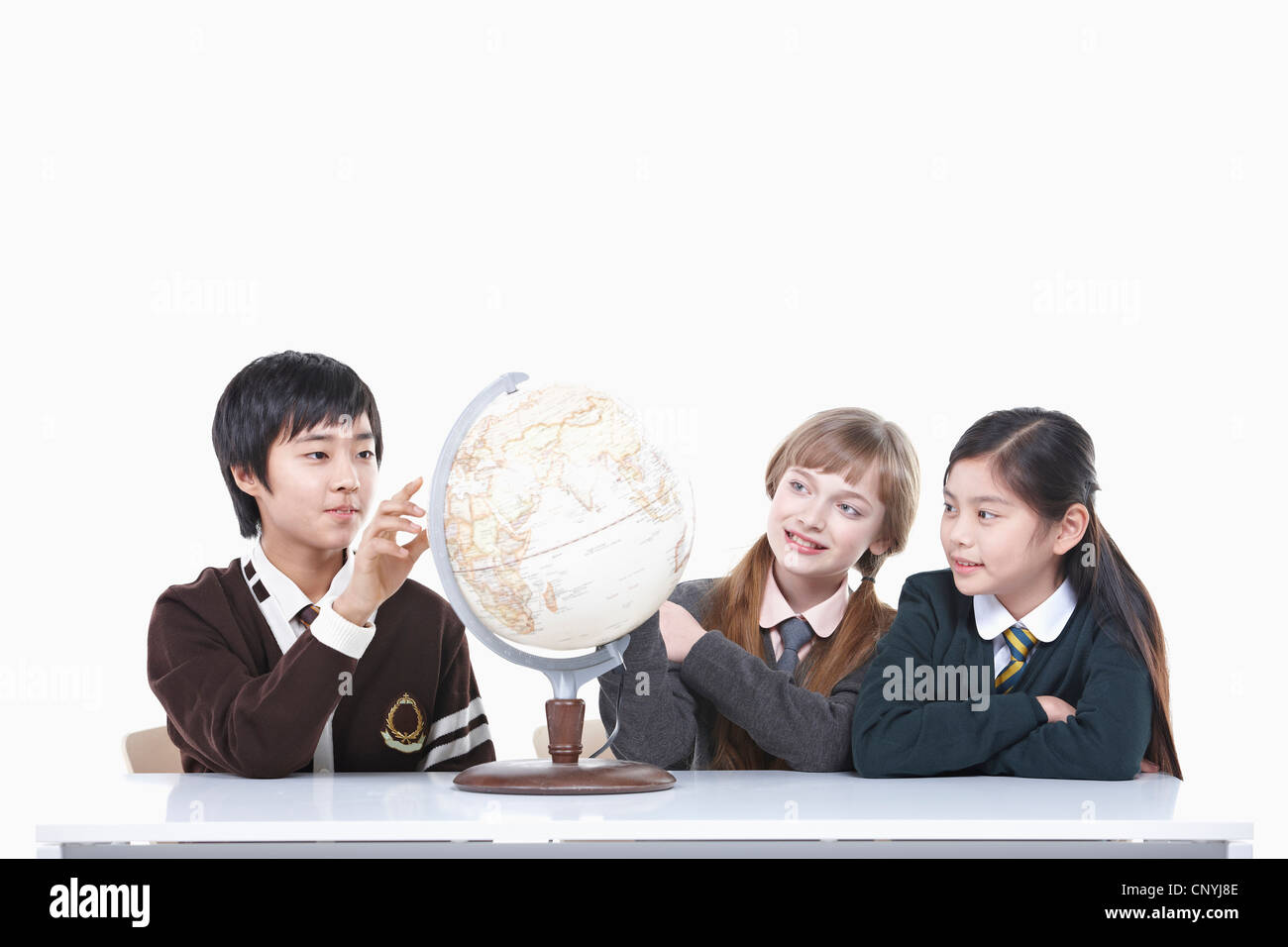The global students looking at the globe Stock Photo - Alamy