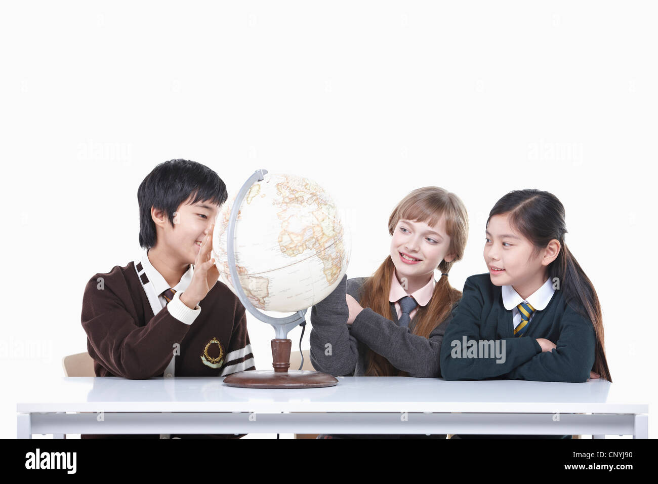 The global students looking at the globe Stock Photo - Alamy
