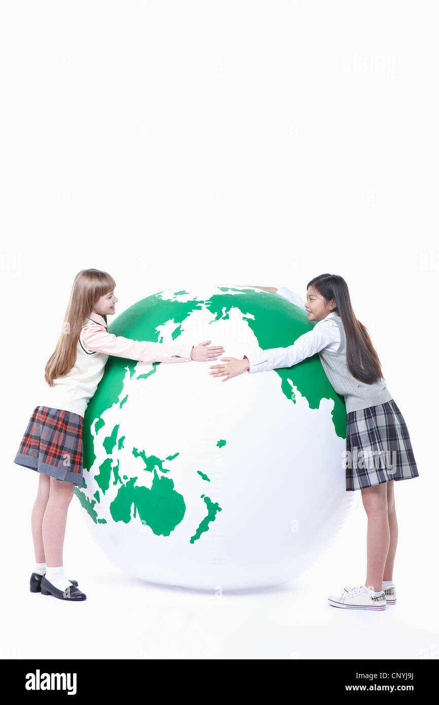 The global students hugging the globe Stock Photo - Alamy