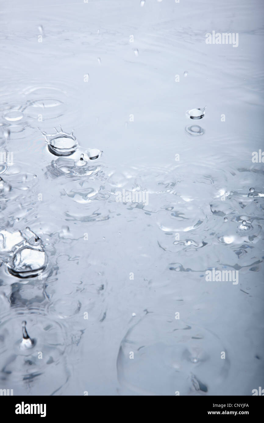 Dropping water onto the surface of water Stock Photo - Alamy