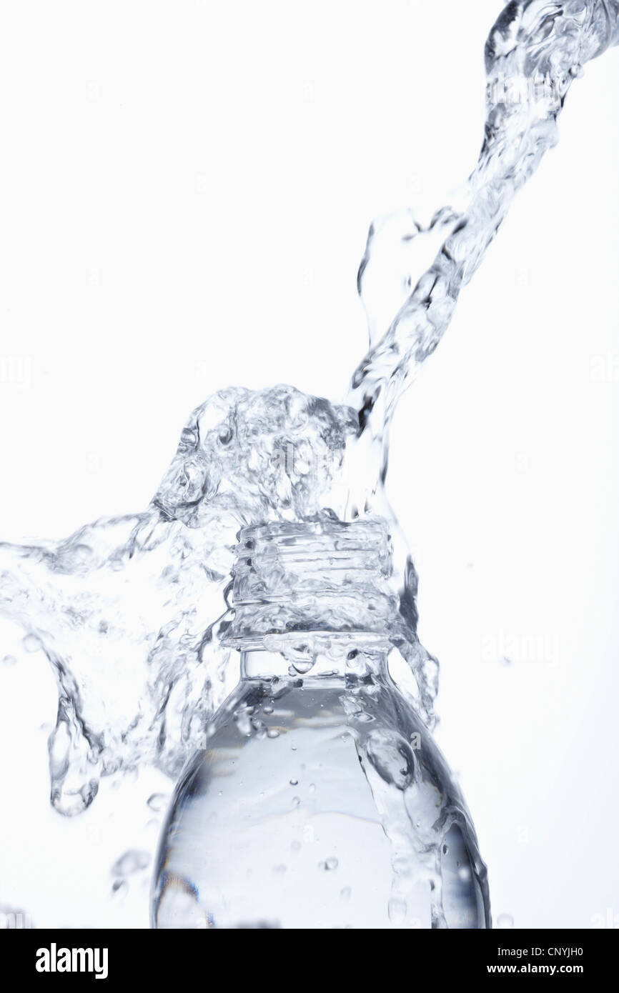 Filling the bottle with water Stock Photo - Alamy