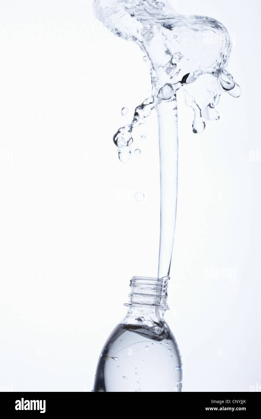 Spring up water from the bottle Stock Photo - Alamy