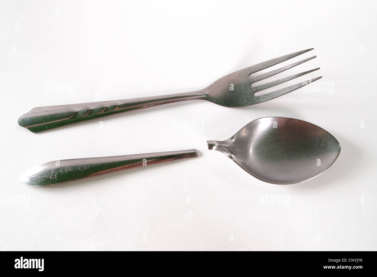 Spoon has been damaged Stock Photo - Alamy