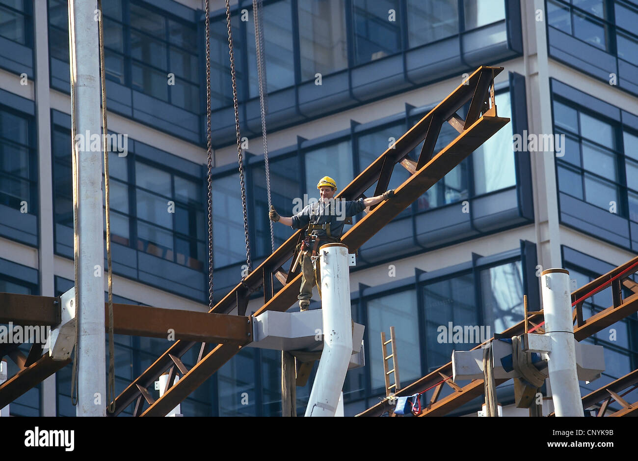 Construction of an office building. Positioning steel girders. City of ...
