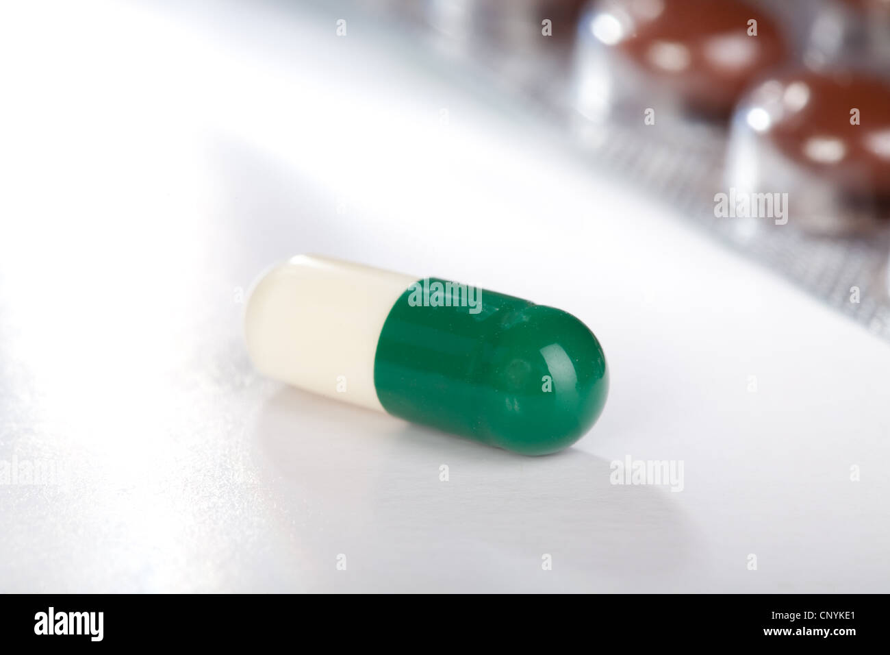 Medicines in capsules and tablets lay on a table Stock Photo - Alamy