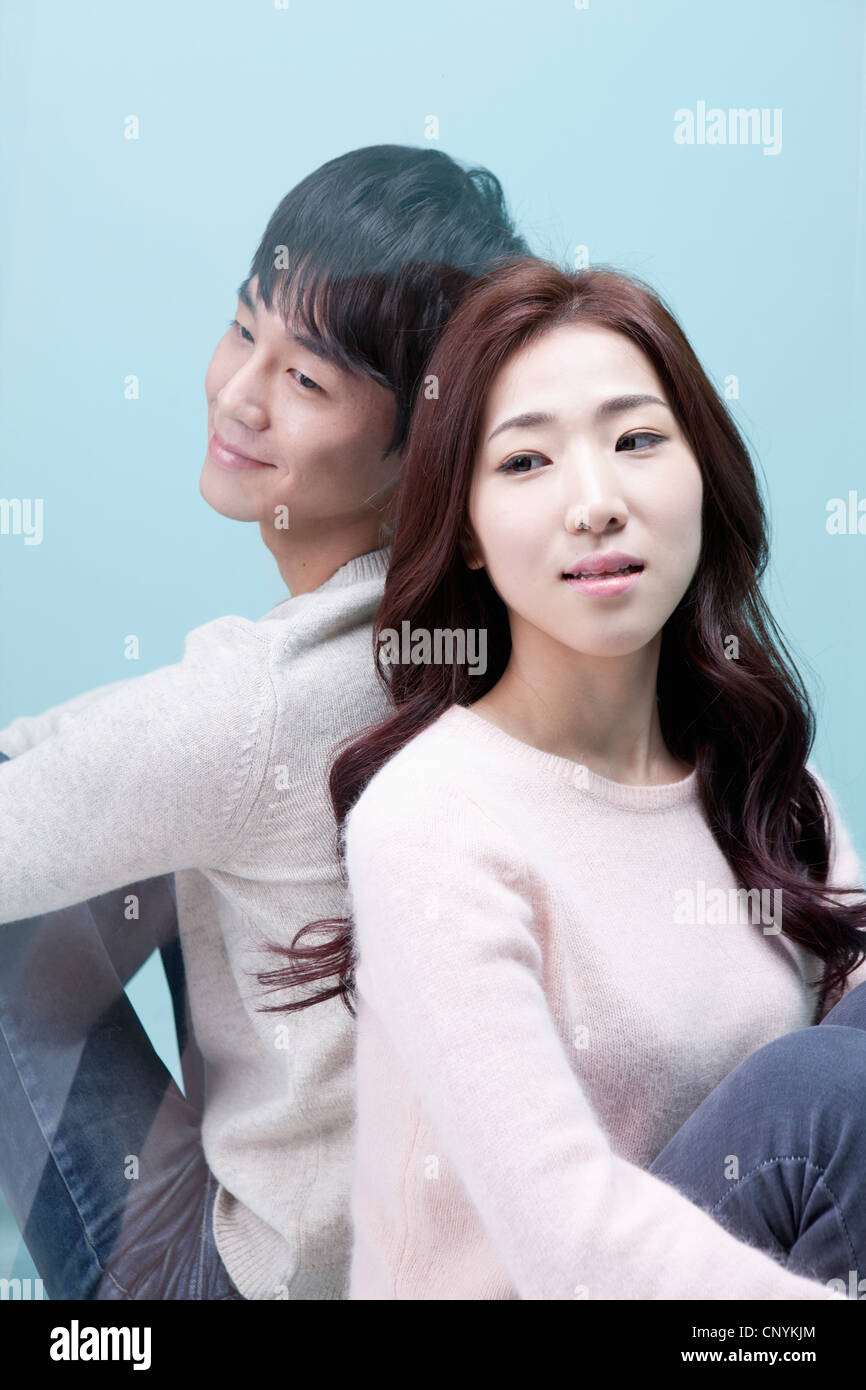 A couple leaning against the window Stock Photo - Alamy