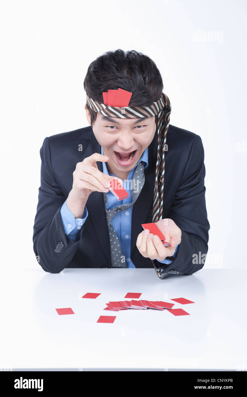 A drunk man gambling at hwatu play Stock Photo - Alamy