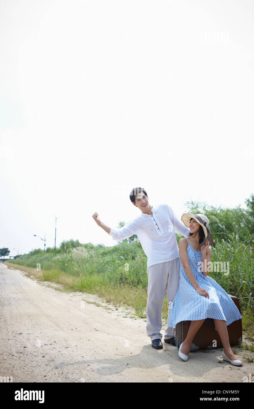 Posing hitchhiking hi-res stock photography and images - Alamy