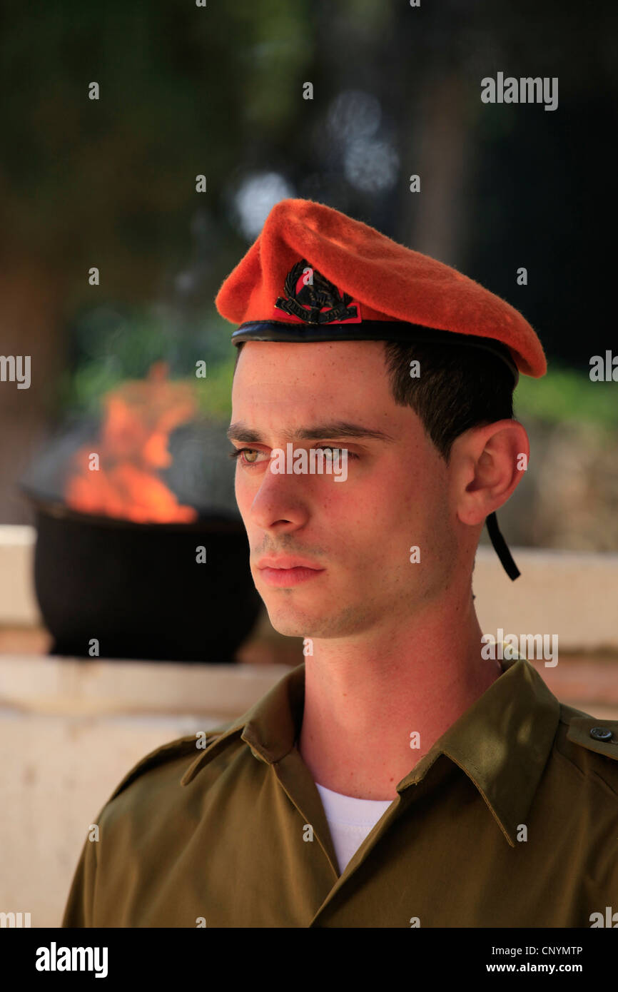 Israeli soldier from the Home Front Command unit stands firm over the ...
