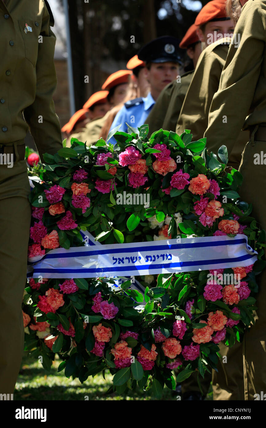 Israeli female soldiers carry wreaths during a memorial ceremony for ...