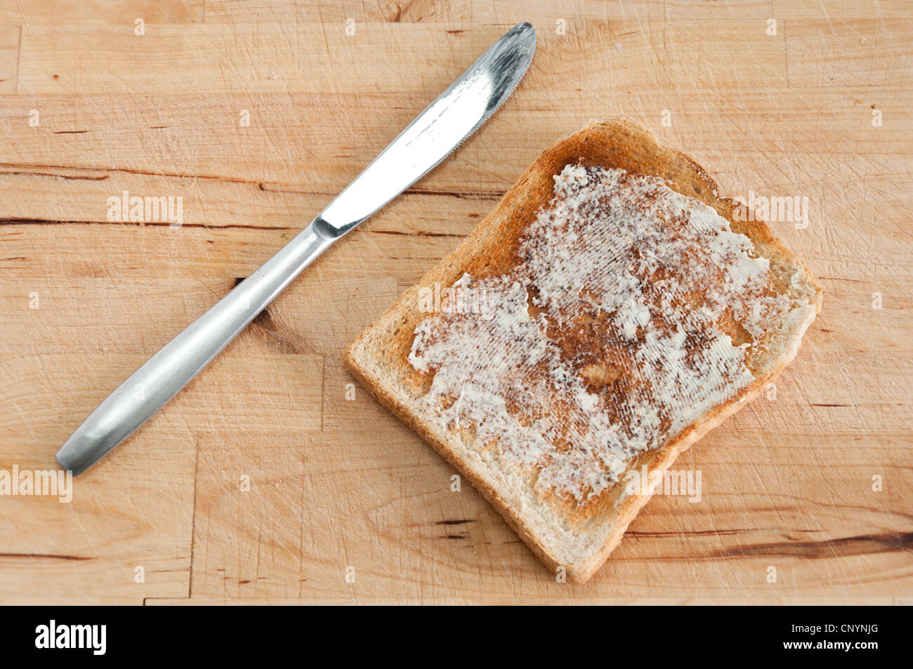One slice of buttered toast Stock Photo - Alamy