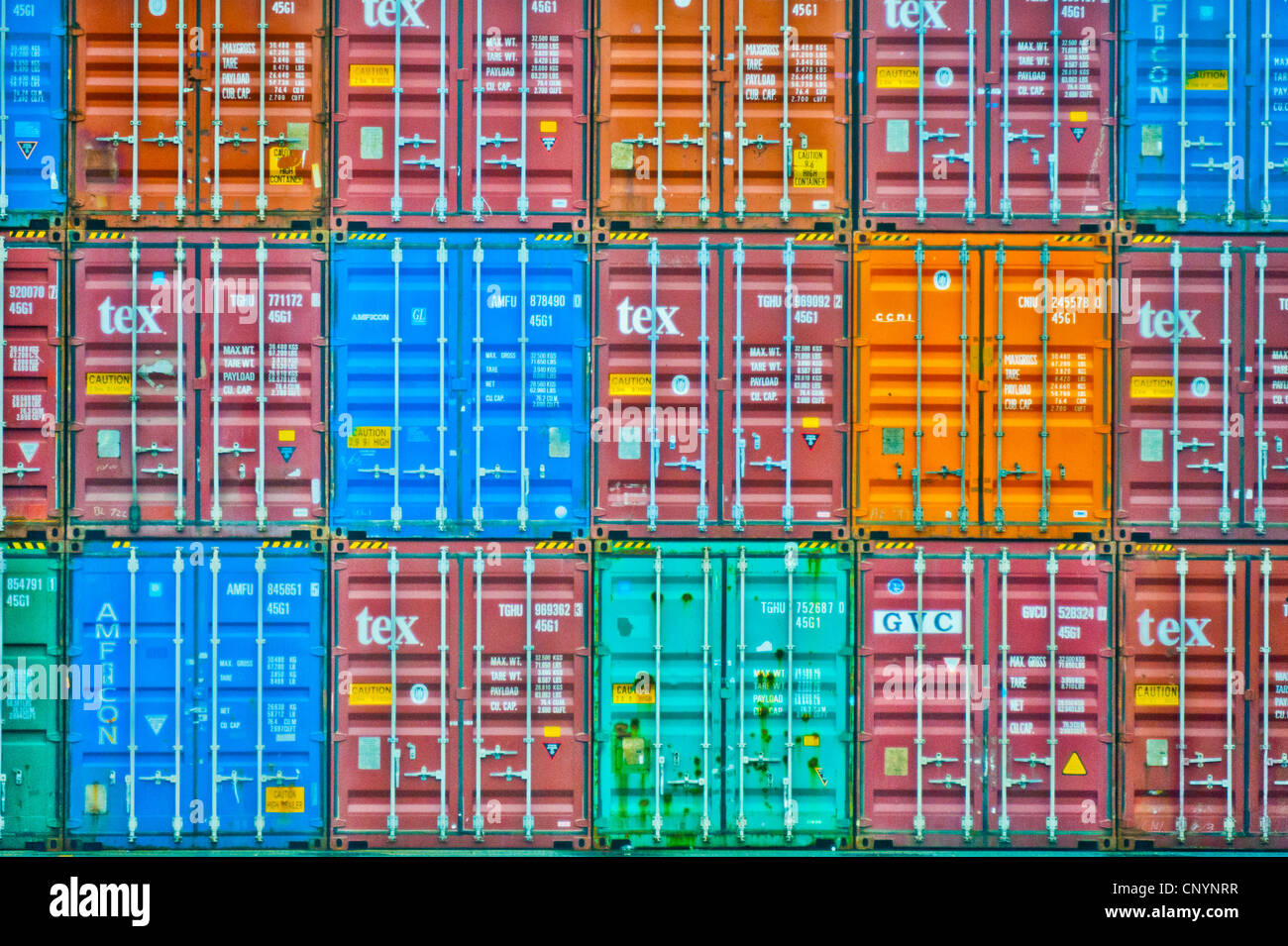 Multi-colored storage crates stacked Stock Photo - Alamy