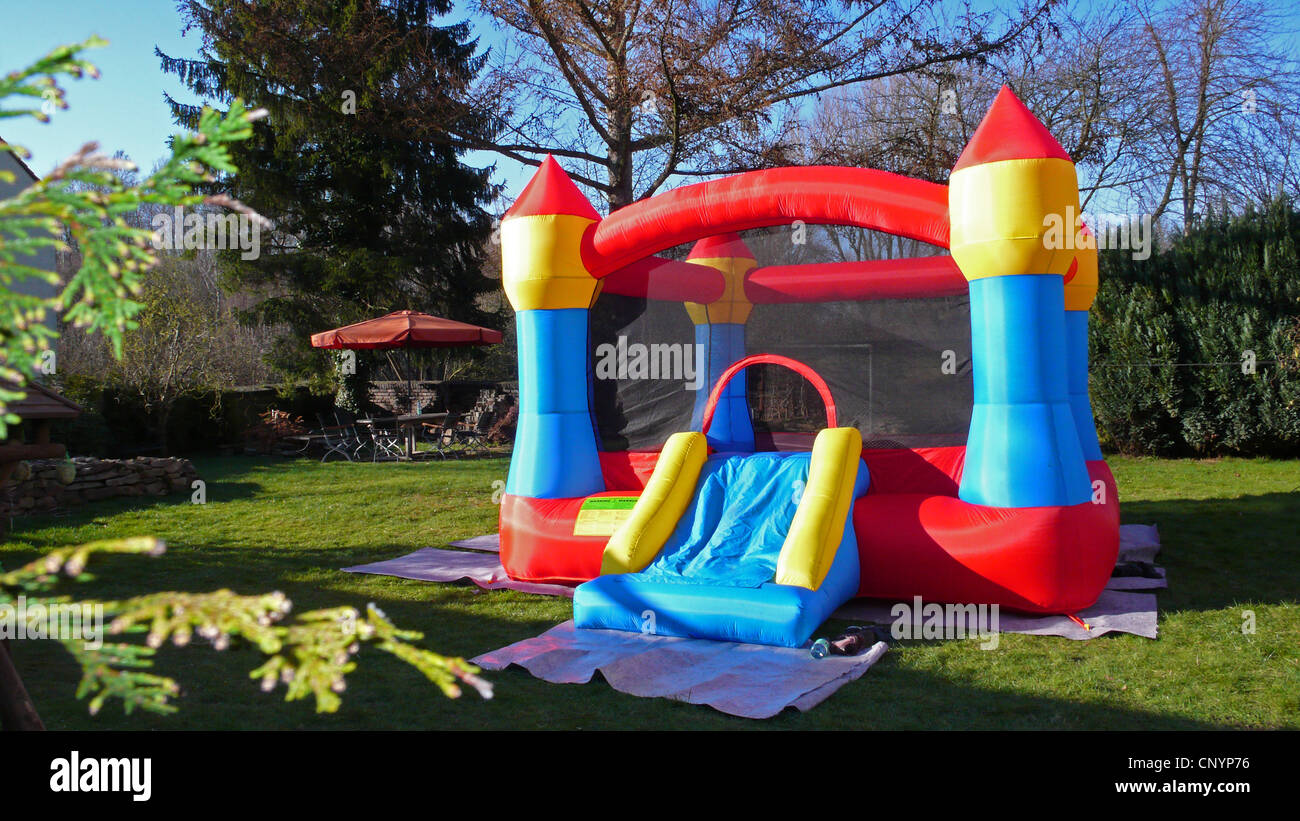 jumping castle in a garden Stock Photo - Alamy