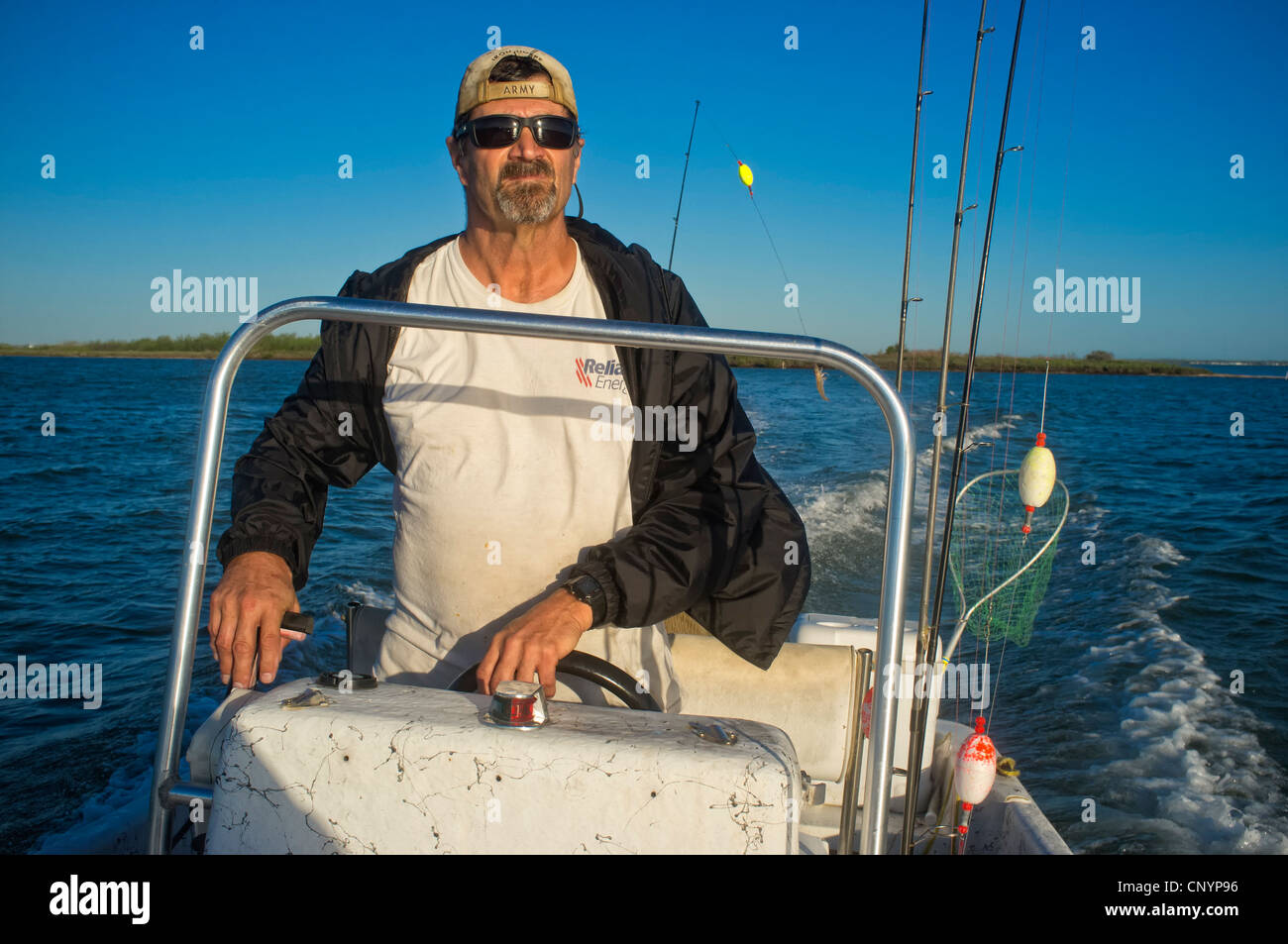 Skipper at small fishing boat Stock Photo - Alamy