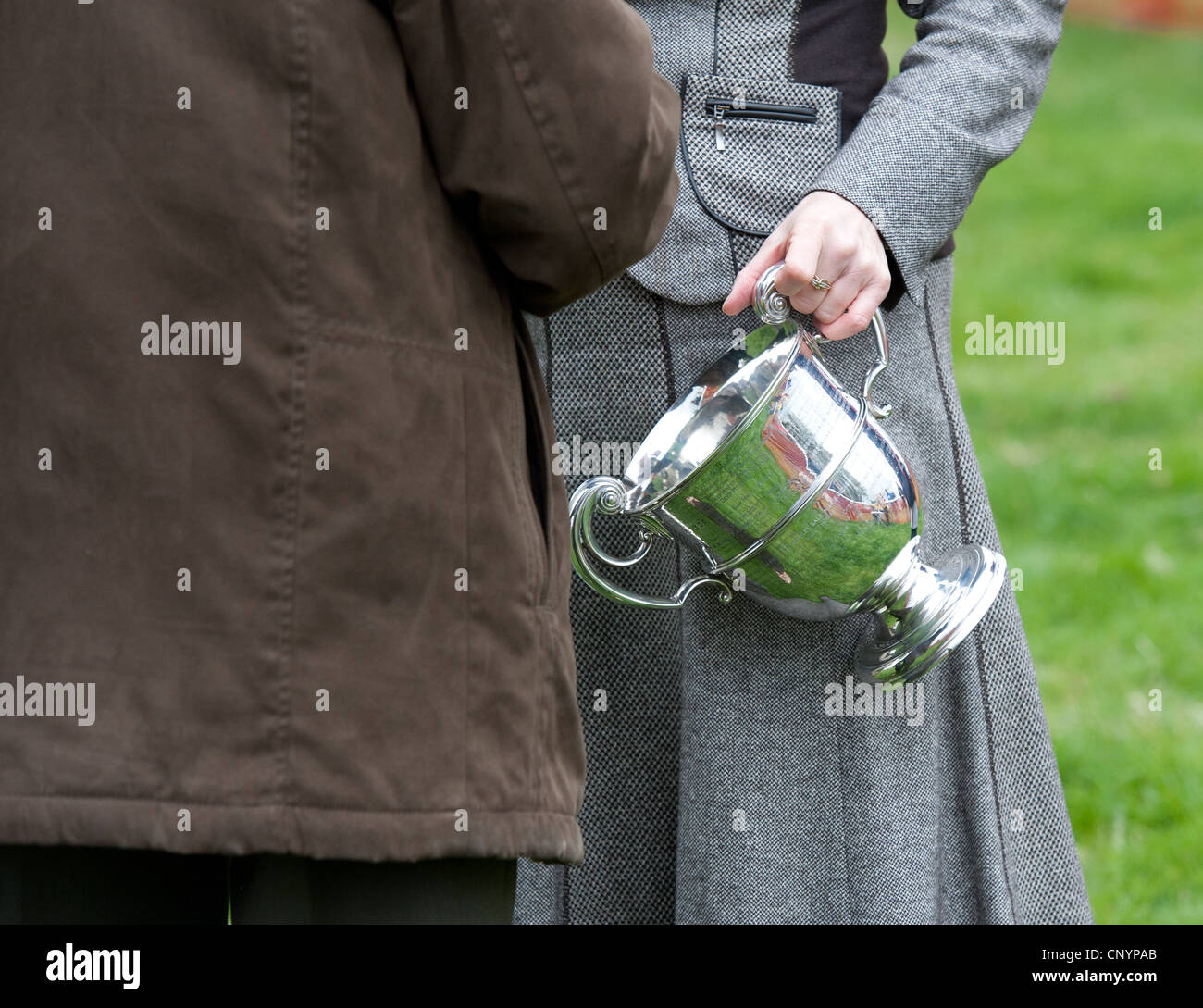 Silver cup and winning a race Stock Photo - Alamy