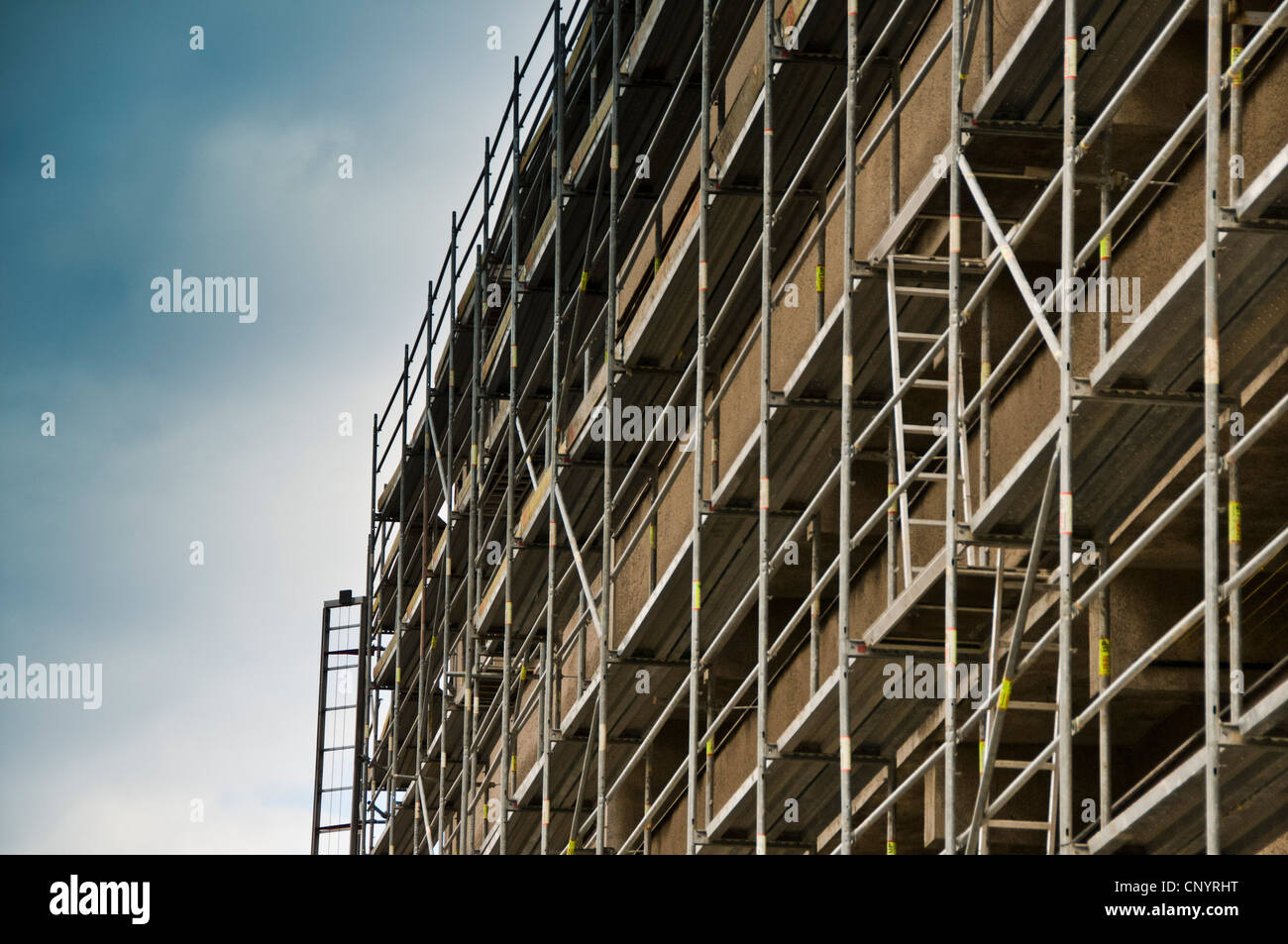 scaffolds covering a building facade Stock Photo - Alamy