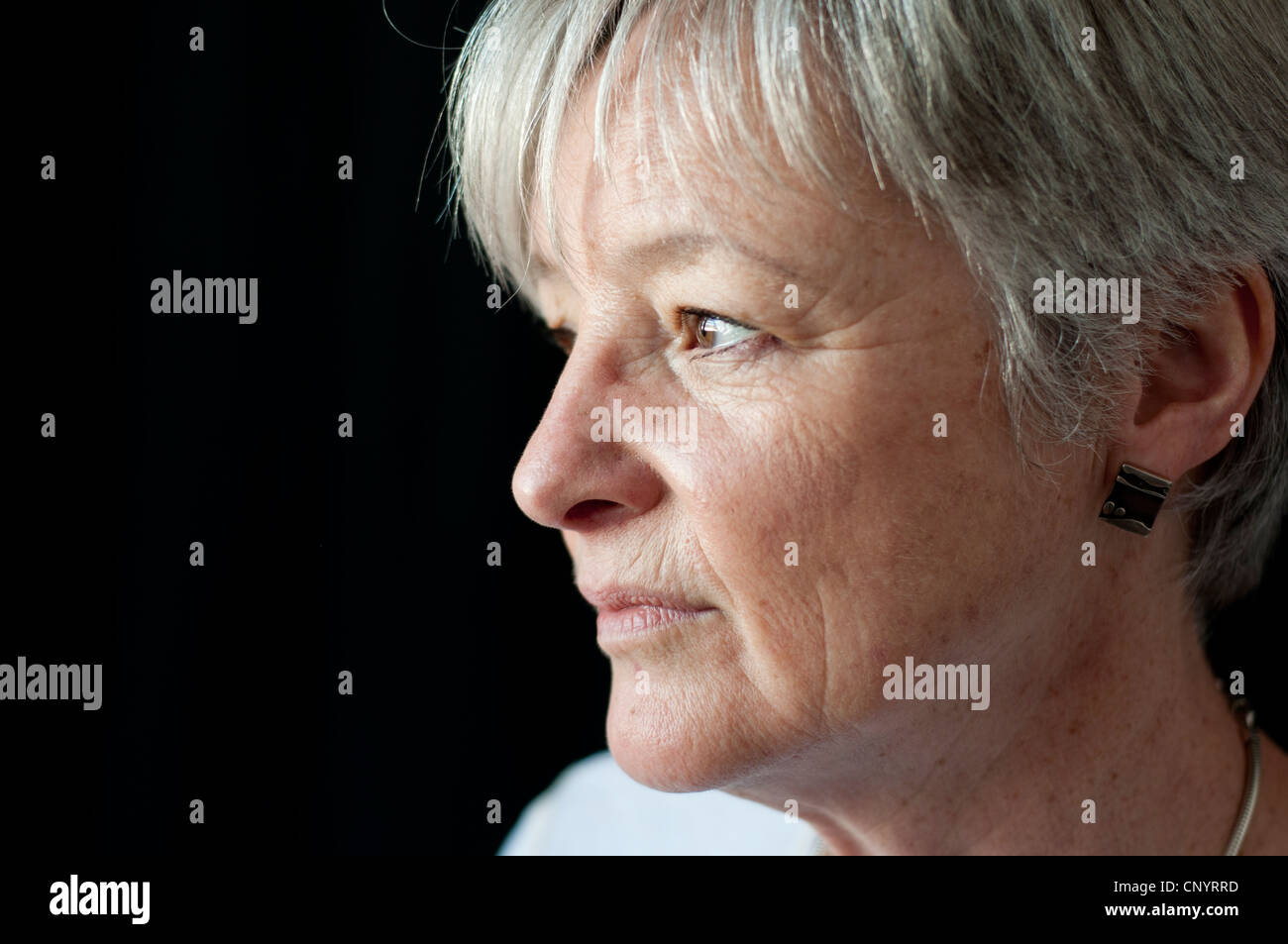 Middle aged woman in close up profile Stock Photo - Alamy