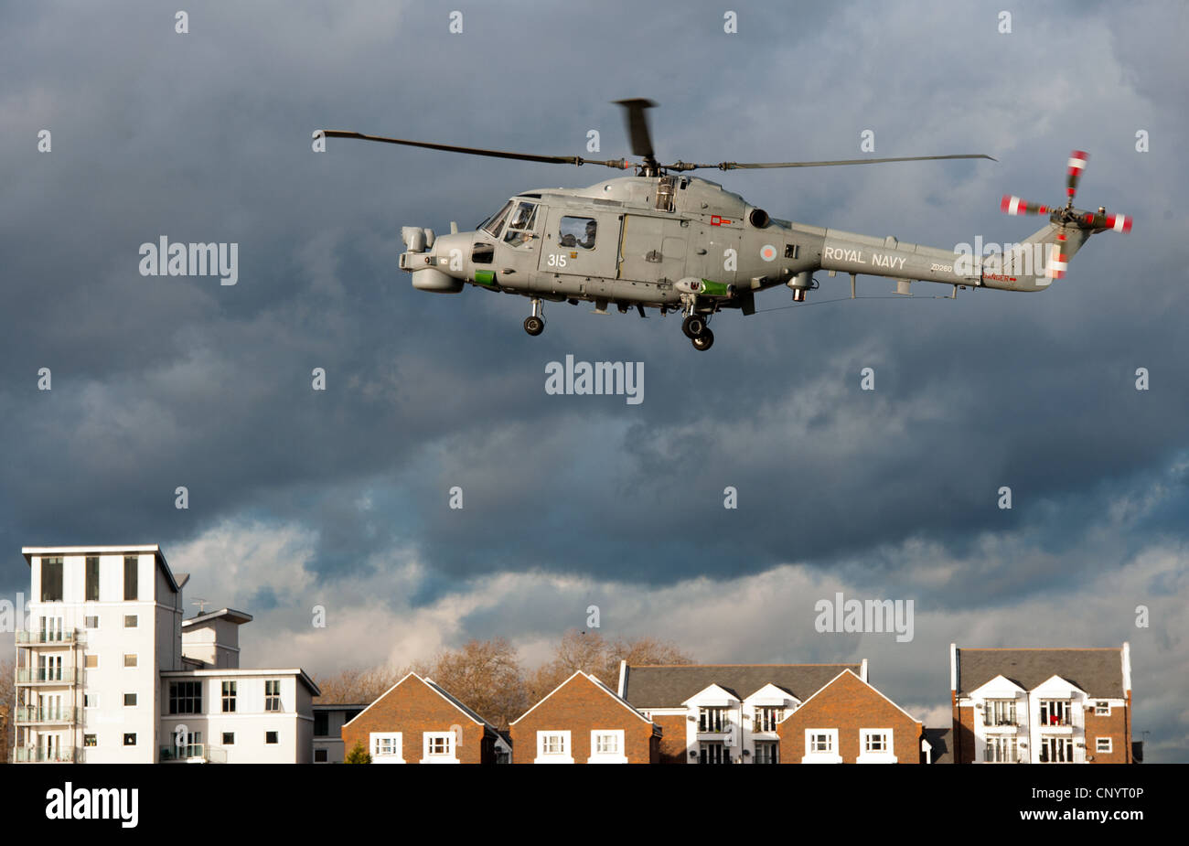 A Royal Navy helicopter flies over the river Thames in London during a ...