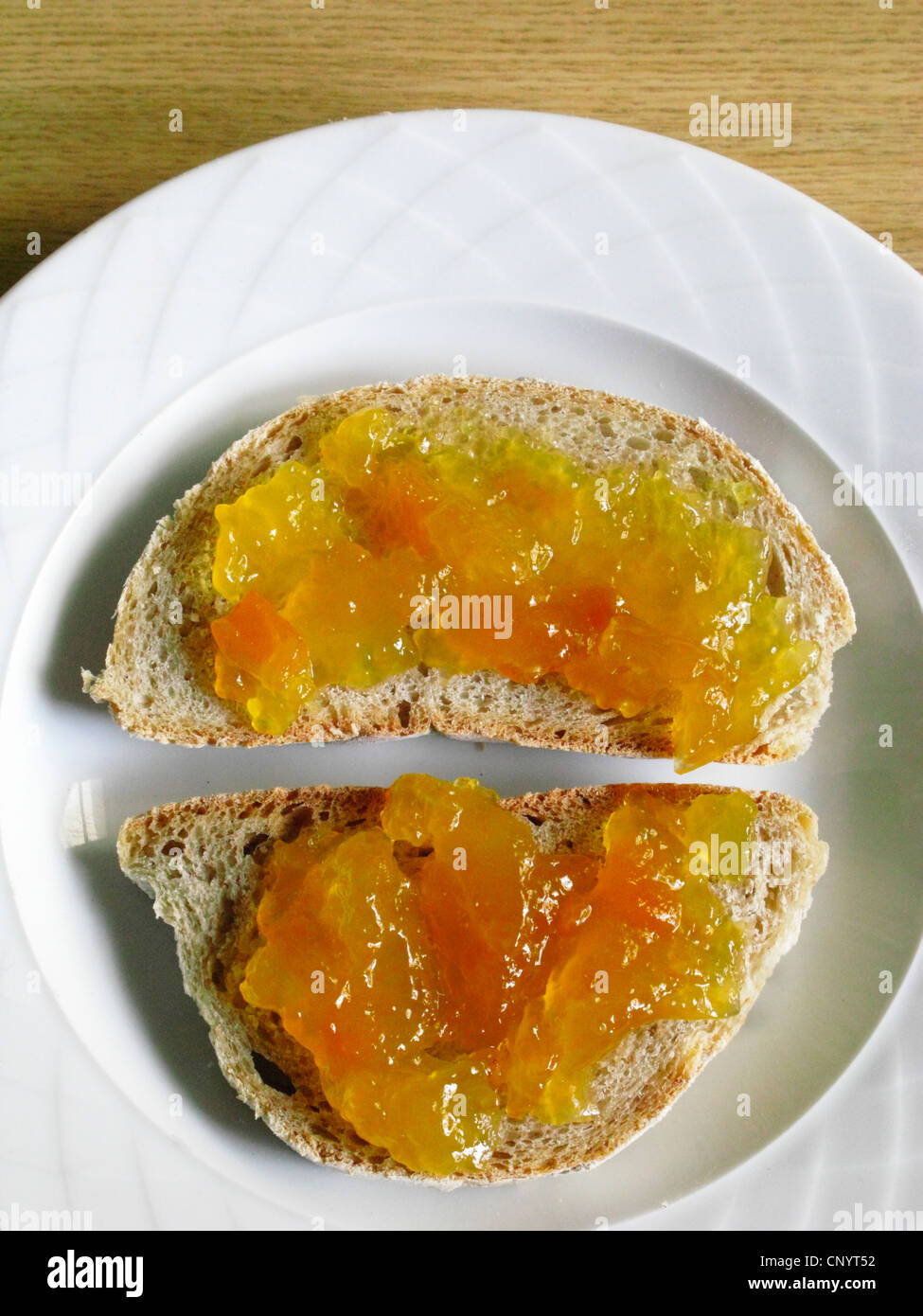 Sliced Brown Bread and Apricot Jam Stock Photo - Alamy
