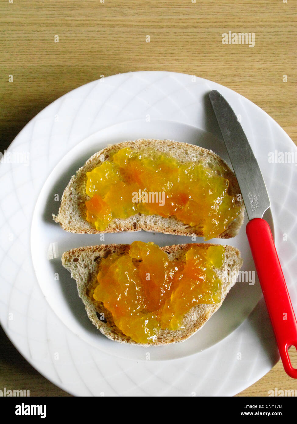 Slice of bread with apricot jam hi-res stock photography and images - Alamy