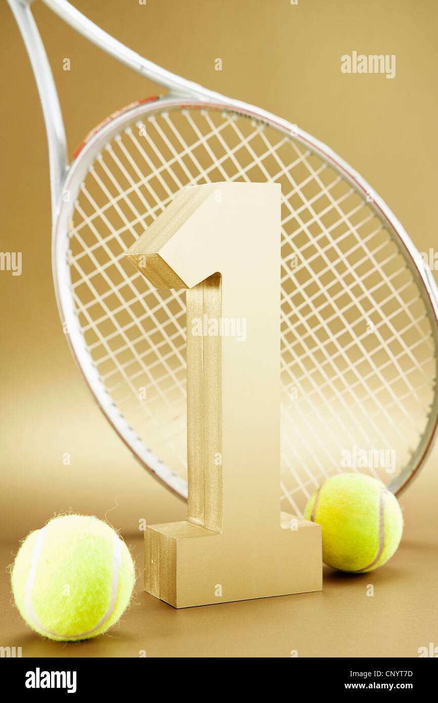 The tennis racket and ball with golden number one Stock Photo - Alamy