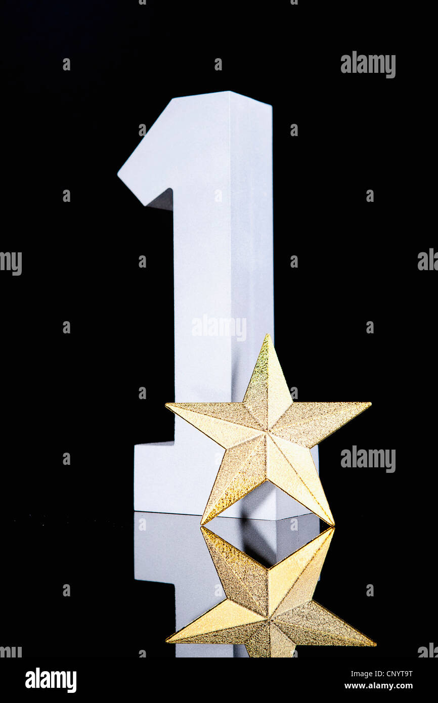 The gold star and number one Stock Photo - Alamy
