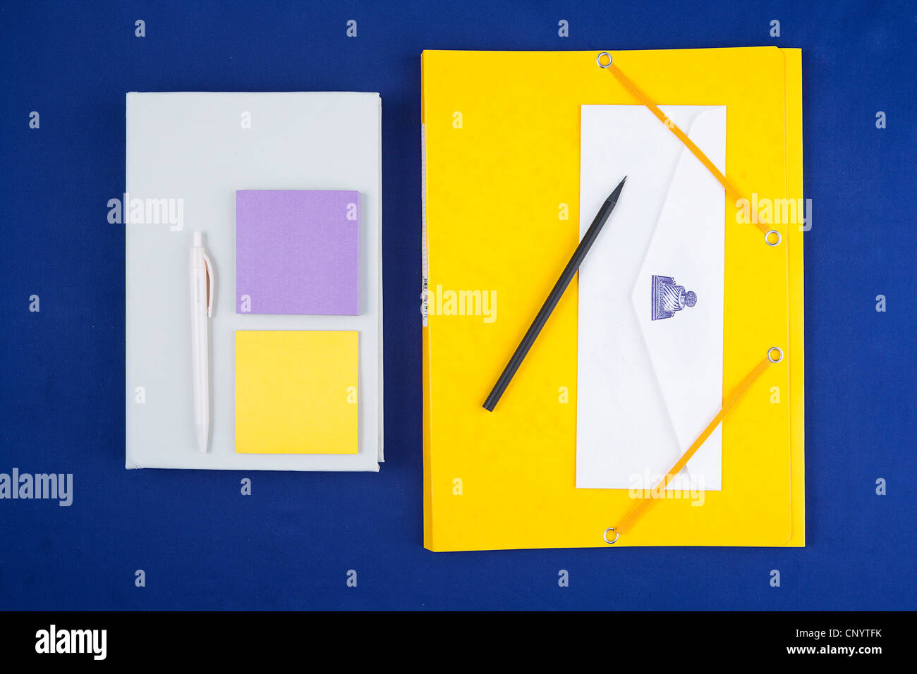 The file folder, pencil, sticky note, and pen Stock Photo - Alamy