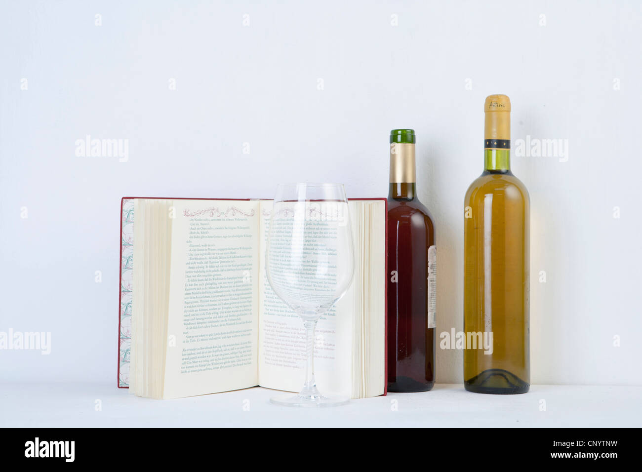 The book, wine glass, and bottles of wine Stock Photo - Alamy
