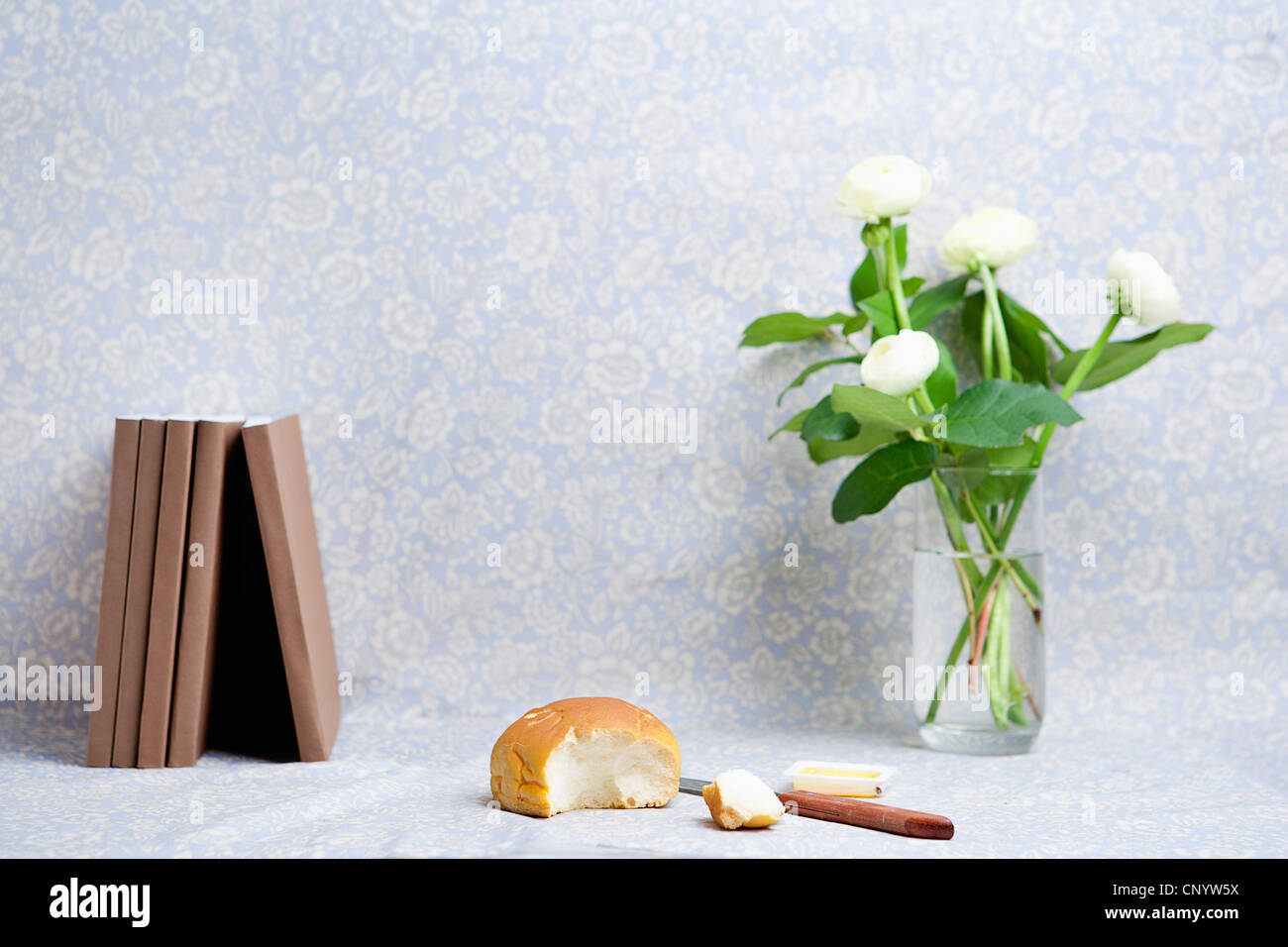 The book, loaf of bread, and flower in vase Stock Photo - Alamy