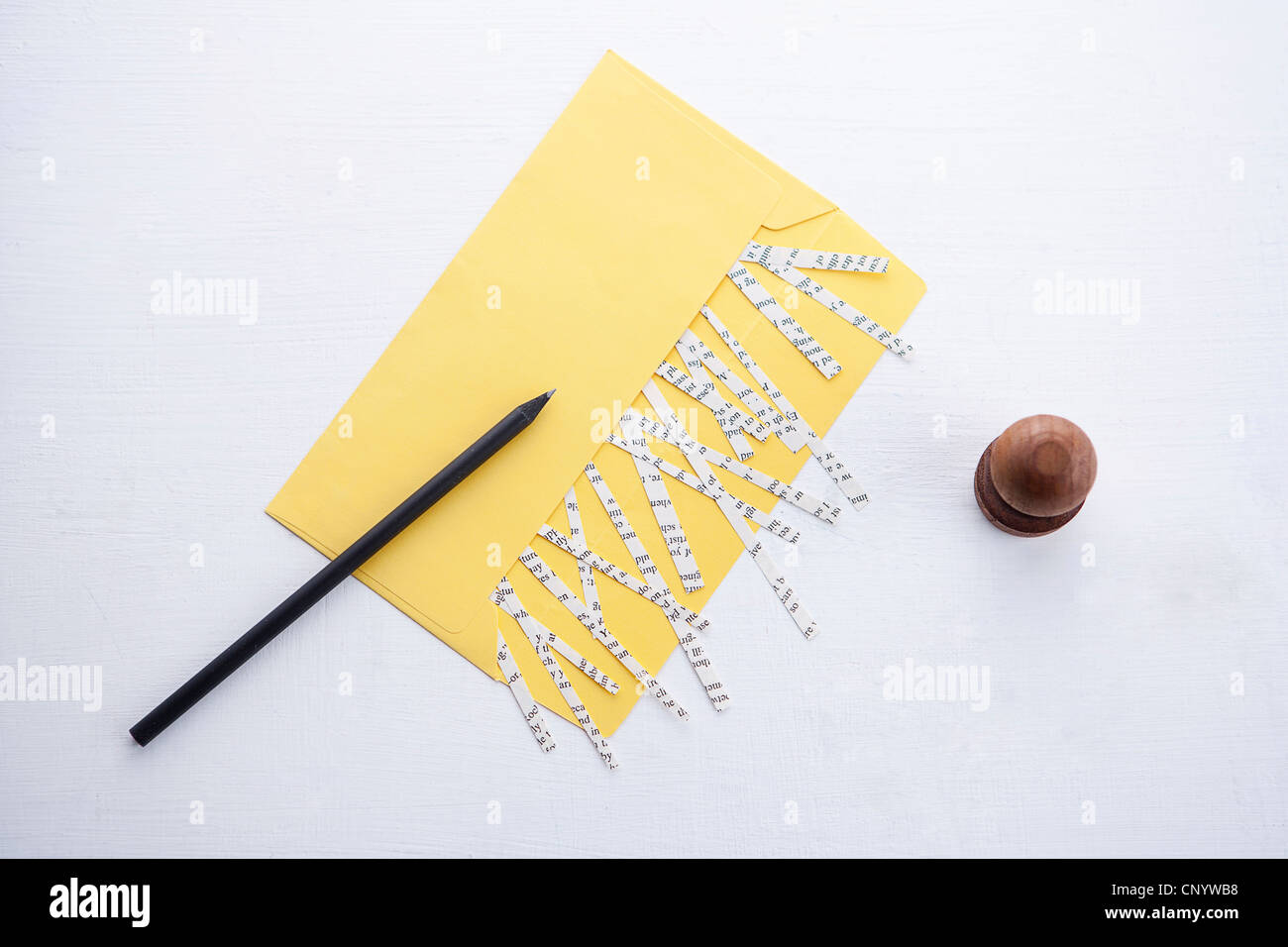 The shredded paper in envelope, pencil, and stamp Stock Photo - Alamy