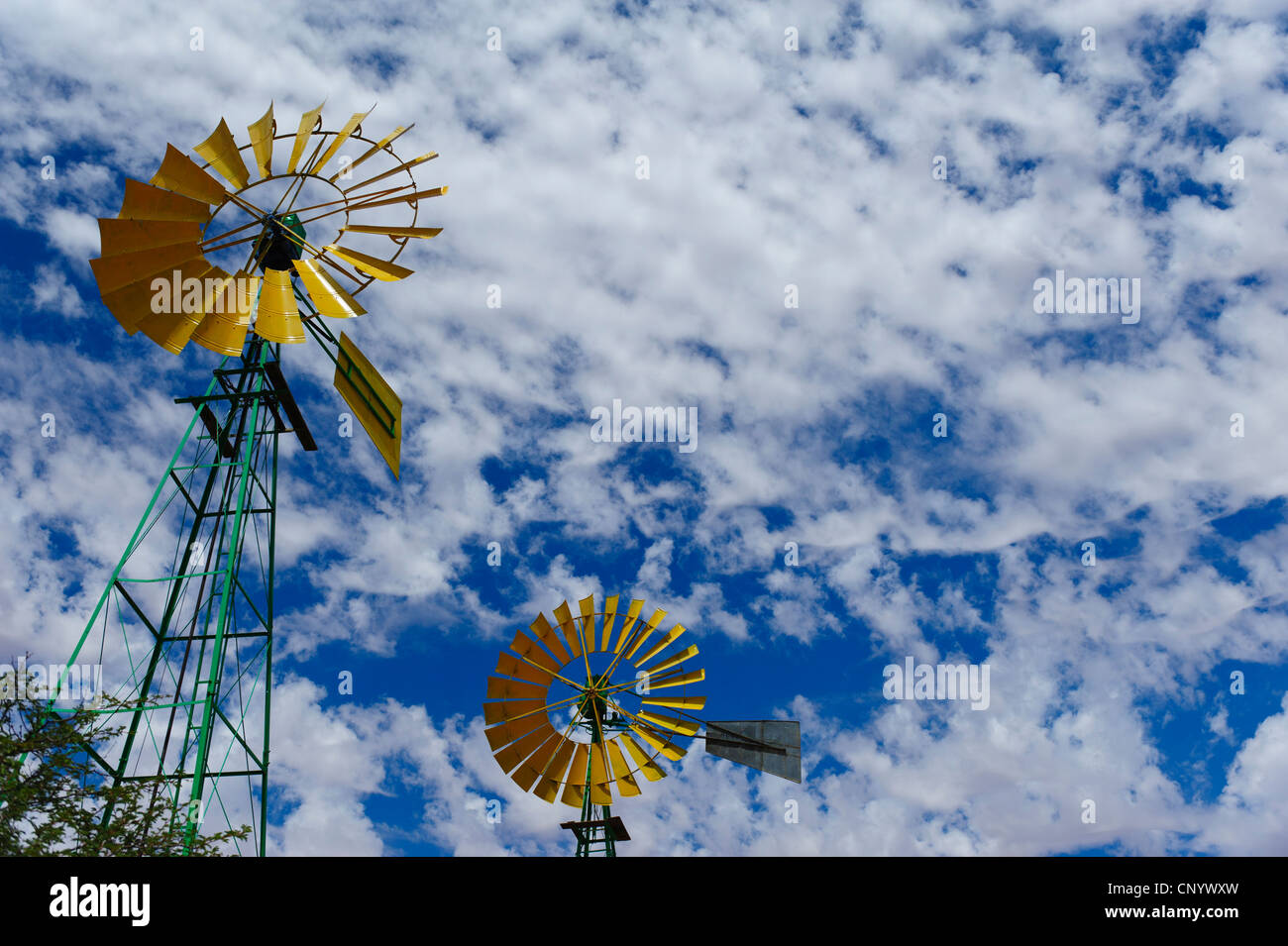 Two yellow coloured windmills seen from below , Namibia Stock Photo - Alamy